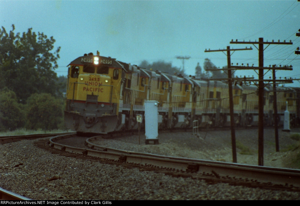 UP 2495 with 7 shsters at high rate of speed.